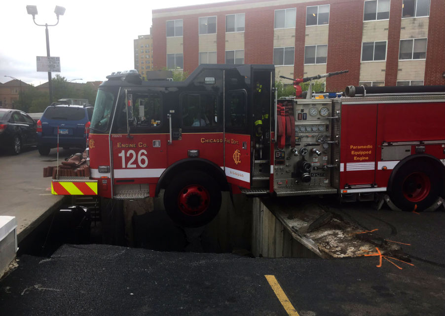 Chicago Fire Truck Stuck Hovering Above Cars After Parking Garage ...